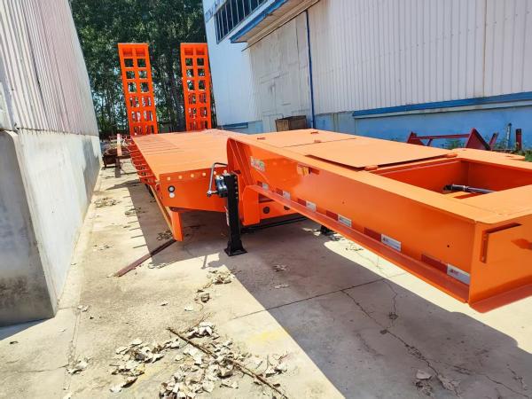 Quality Orange 3-Axle Lowboy Semi-Trailer: 60T Payload, Sturdy Design for Heavy Loads for sale