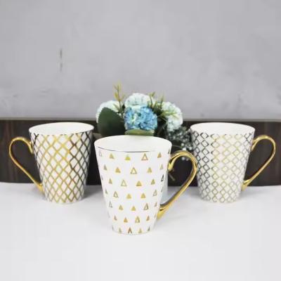 China Electroplated ceramic cup mug gold flower logo for gift for sale