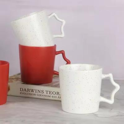 China New products good quality red and white ceramic tea coffee mug with star handle for sale