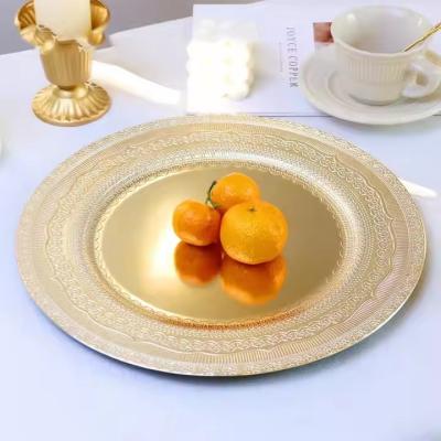 China Round luxury dishes & plates plastic plates for restaurant gold embossed rim acrylic charger plates wedding decorations for sale