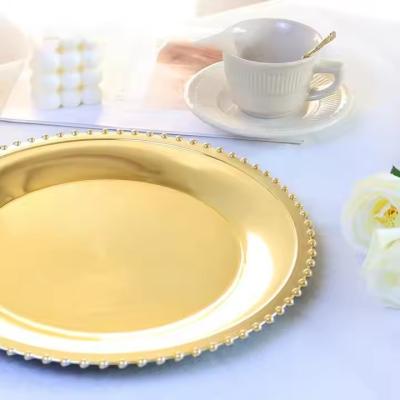 China Gold beaded charger plate round wholesale dinner plate wedding decorative plastic gold plate charger for sale