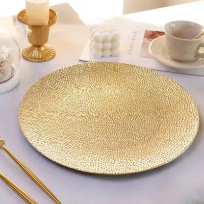 China Cheap banquet charging board retro plastic gold charger plates wedding party decorative 13 inch charger plate for sale