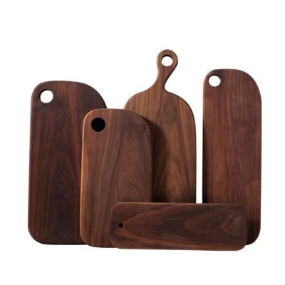 China Black walnut creative mini wood chopping board cutting with hole for sale