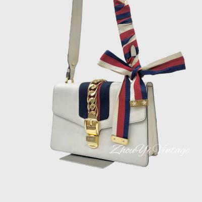 China Entrupy White Leather Shoulder Bag Detachable Ribbon Used Crossbody Bag for sale