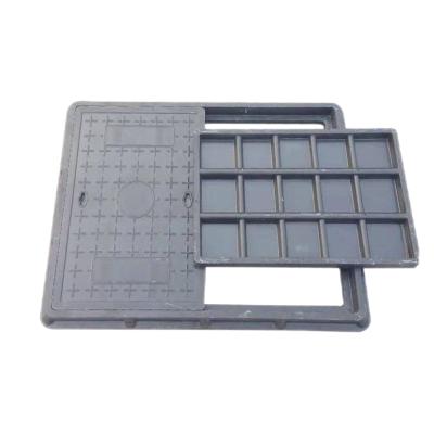 China Embedded Composite D400 Manhole Cover 600mm With Hinge For Telecommunication for sale