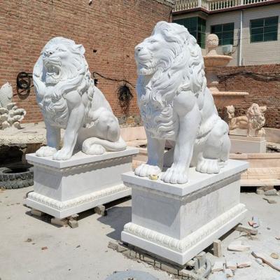 China Custom Design Sunset Red Marble Stone Lion Statue Sculpture with Hand Carved Technique for sale