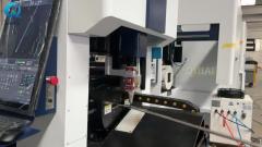 Horizontally mounted tube laser cutting machine with head removing