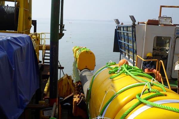 Pipeline foam buoys attached to underwater pipe