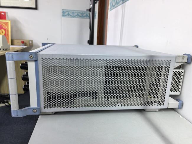Side view of CMW500 K50 test equipment showing ventilation and chassis details