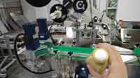 China Lubricant Bottle Cap Labeling Machine PLC Control Fast Labeling Machine for sale