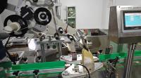 China Lubricant Bottle Cap Labeling Machine PLC Control Fast Labeling Machine for sale
