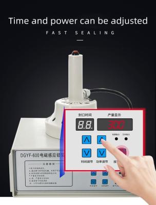 China Maximale snelheid 50pcs/min Draagbare plastic fles Aluminium folie Inductie afdichting machine Te koop