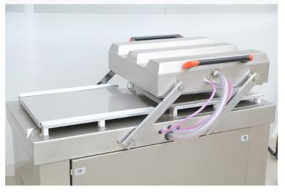 Cina Macchine di imballaggio a vuoto a mattoni di riso per imballaggio di sacchetti di plastica in vendita