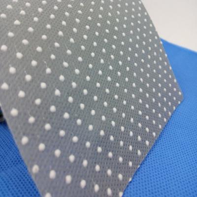 China PP + PVC dot coated anti skid material nonwoven non slip fabric for sale