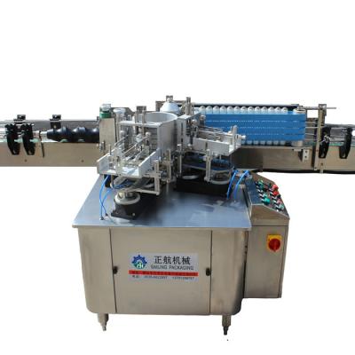 Cina Food factory price round bottles automatic cold glue self adhesive labeling machine for automatic simple labeling in vendita