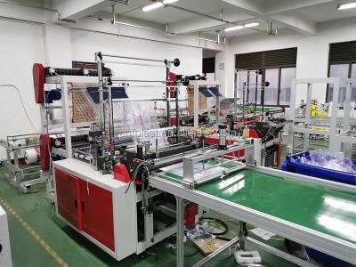 Cina Good price biodegradable plastic tshirt and flat bag cutter machine with conveyor belt in vendita