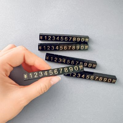 China L9*6mm 100set jewellery display price digital cube  Gold letters Black Background For Retail Shop display customizable for sale