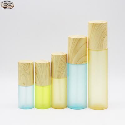 China Personal Care Frosted Plastic Lotion Bottle with Bamboo Lid for sale