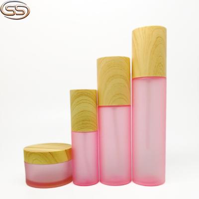 China 50ml 110ml 150ml Frosted Plastic Cosmetic Packaging Wood Cap Bottle and 50g Cream Jar for sale