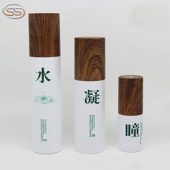 China Screen Printing Handling Plastic Cosmetic Lotion Pump Bottle with Wooden Cap for sale