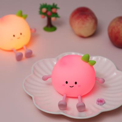 China 2024 New Creative Peach Shape Night Lamp Soft Silicone 7 Color Changing Eye Care Night Light For Children Gifts Desk Lamp for sale