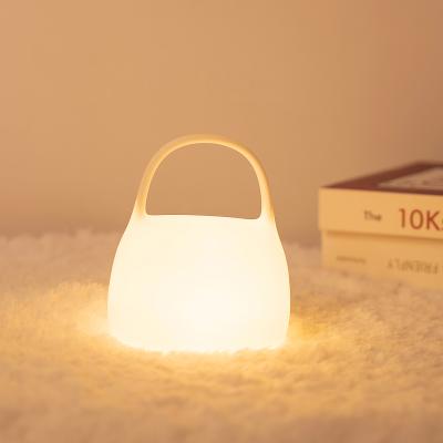 Cina DIY Creative Gift Handbag Silicone Lampada da applauso con tempo Decorazione a bordo letto Atmosfera Luce notturna per dormire in vendita