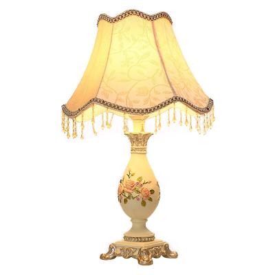 China Hot sales modern European style fabric lamp shade antique brass luxurious gift parlour LED resin table lamp for sale