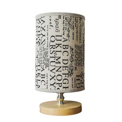 China Factory direct selling solid wood table lamp modern simple fabric bedroom bedside lamp warm eye protection desk dormitory lamp for sale