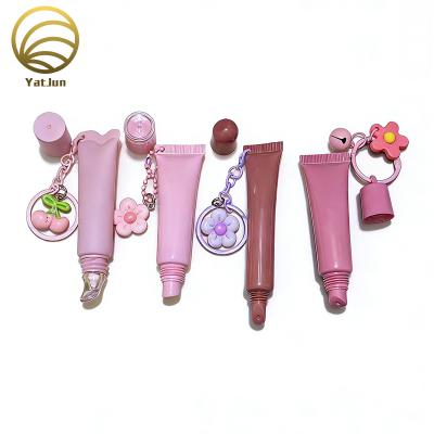 China 10ml 20g empty round plastic PE tube with hang charm screw cap for sale