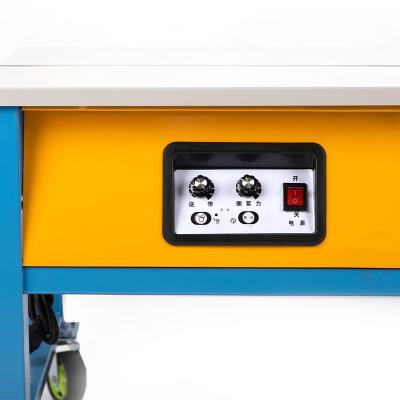 China MH-DML-92 High Efficiency Double Motor Semi-Automatic Baler Carton Packing PP Tape Strapping Machine for sale