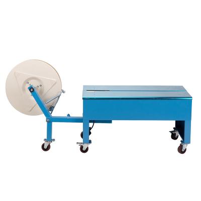 Cina MH-TDML-91 Semi-automatica Strapping Machine per magazzini e logistica 6-15.5mm PP cinture 0.5-0.85mm Spessore 3 secondi Strapping in vendita