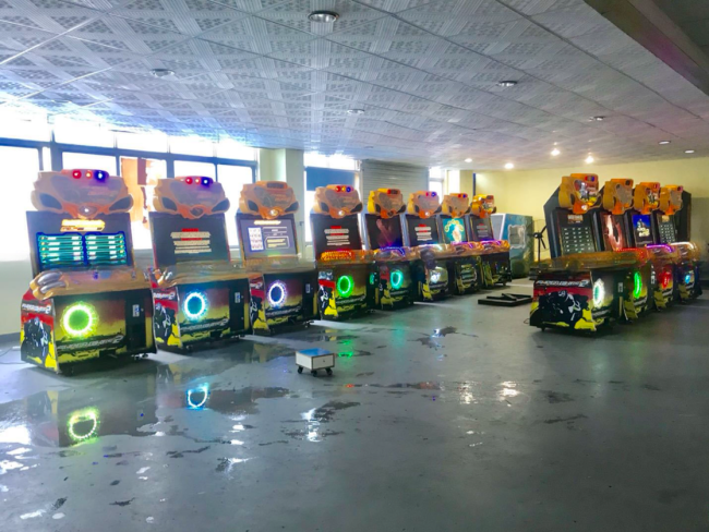 Player using motorbike arcade machine