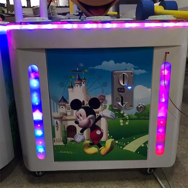 Children playing whack the mole game