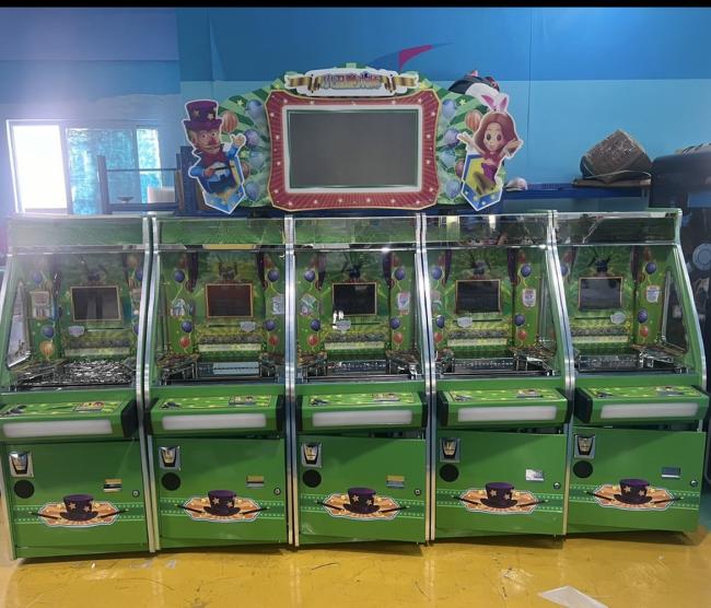 Game machine side view showing dimensions