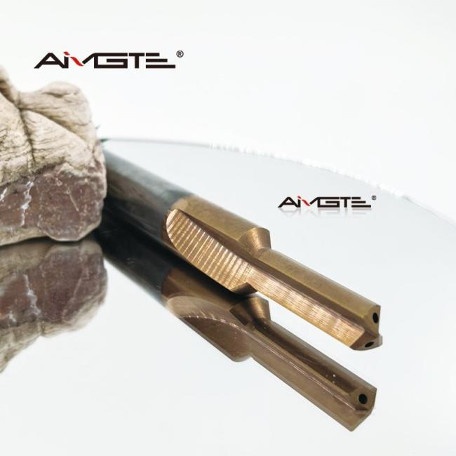 Close-up of AlTiSiN coated carbide step drill bit showing flute design