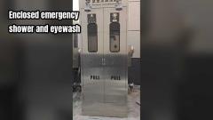 Enclosed emergency shower and eyewash