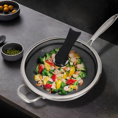 Cina Il bastone libero della vendita all'ingrosso PFOA della fabbrica non funziona 18/8 di pentola del wok di acciaio inossidabile con la copertura di vetro in vendita