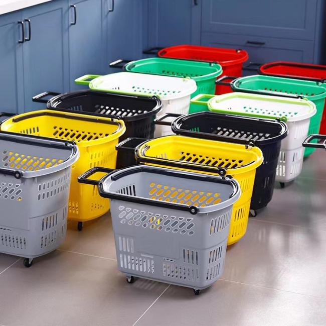 Close-up view of plastic shopping basket showing wheel and handle details