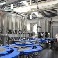 China 6000-8000 BPH Monoblock Liquid Filling Machine with Particles Dosing for Juice Hot Fill for sale
