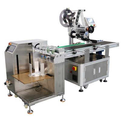 Cina 220V Voltage Pneumatic OPP Bag Labeling Machine con capacità di 2000 set/mese in vendita
