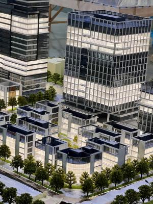Architectural Model of Modern Urban Complex with Integrated Stadium, Business District and Landscaping