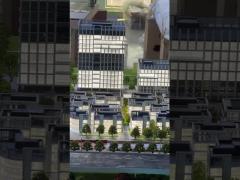 Architectural Model of Modern Urban Complex with Integrated Stadium, Business District and Landscaping