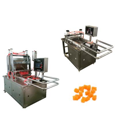 China Máquina de depósito de goma de frambuesa de plátano de acero inoxidable para hacer caramelos rápidos con jalea en venta