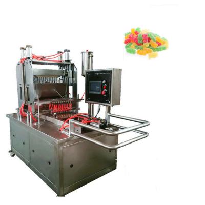 China Máquina de depósito de goma de frambuesa de plátano de acero inoxidable para hacer caramelos rápidos con jalea en venta