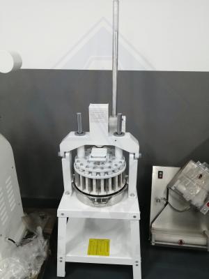 China Divididor de masa Máquina manual para dividir y redondear la masa con agua como materia prima en venta