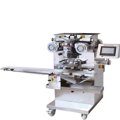 China 110/220v Voltage Small Kubba Mooncakes Encrusting Machine with 390kg Packing Weight for sale