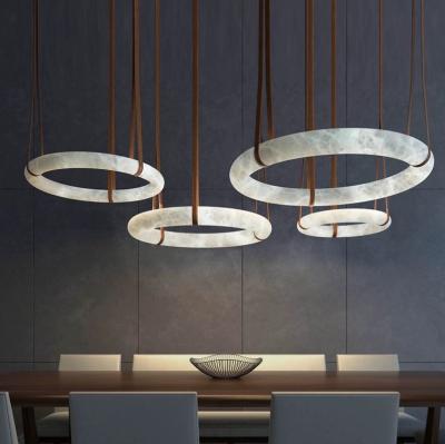 Cina Luce di lusso di pelle lampadario cerchio di marmo cucina soggiorno arte creativa alabastro luce lampada appesa in vendita