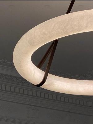 Cina Luce di lusso di pelle lampadario cerchio di marmo cucina soggiorno arte creativa alabastro luce lampada appesa in vendita