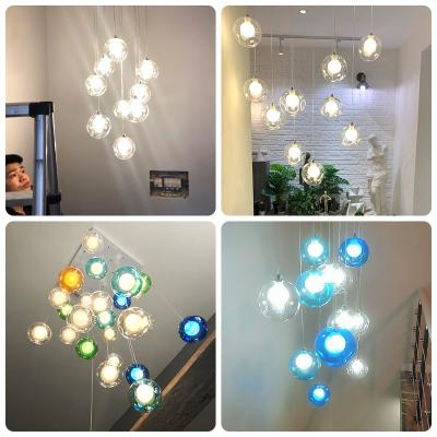 Cina Lampada a sfera di vetro a scala lunga a sospensione a LED Luce di soffitto Illuminazione creativa per la casa lampadario moderno in vendita