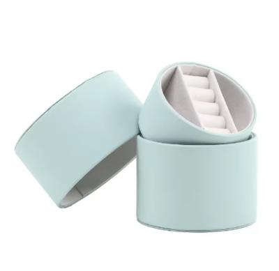 China Portable Round Leather Travel Jewelry Box For Rings And Necklaces for sale